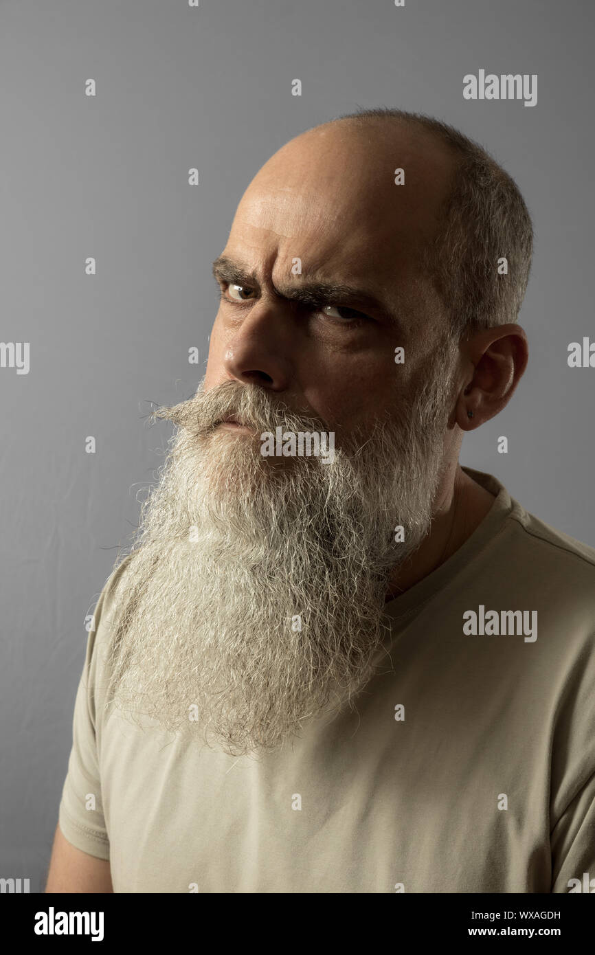 Angry man and long white beard hi-res stock photography and images - Alamy