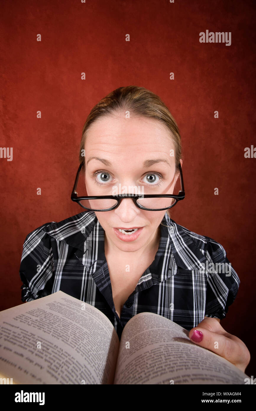 Woman big eyes glasses reading hi-res stock photography and images - Alamy