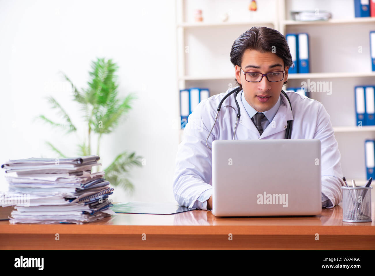 Doctor workload hi-res stock photography and images - Alamy