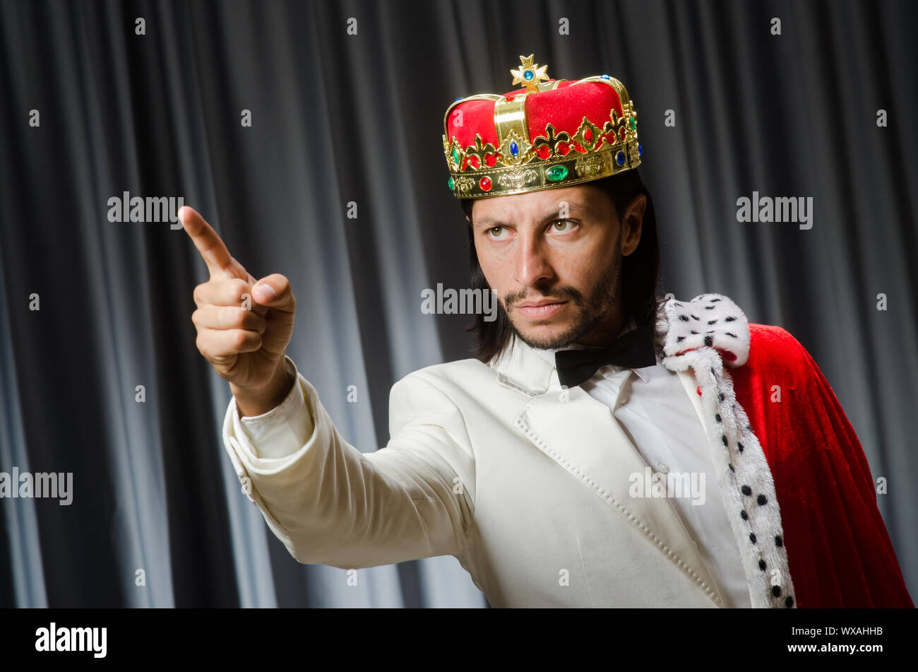 Funny king wearing crown in coronation concept Stock Photo - Alamy