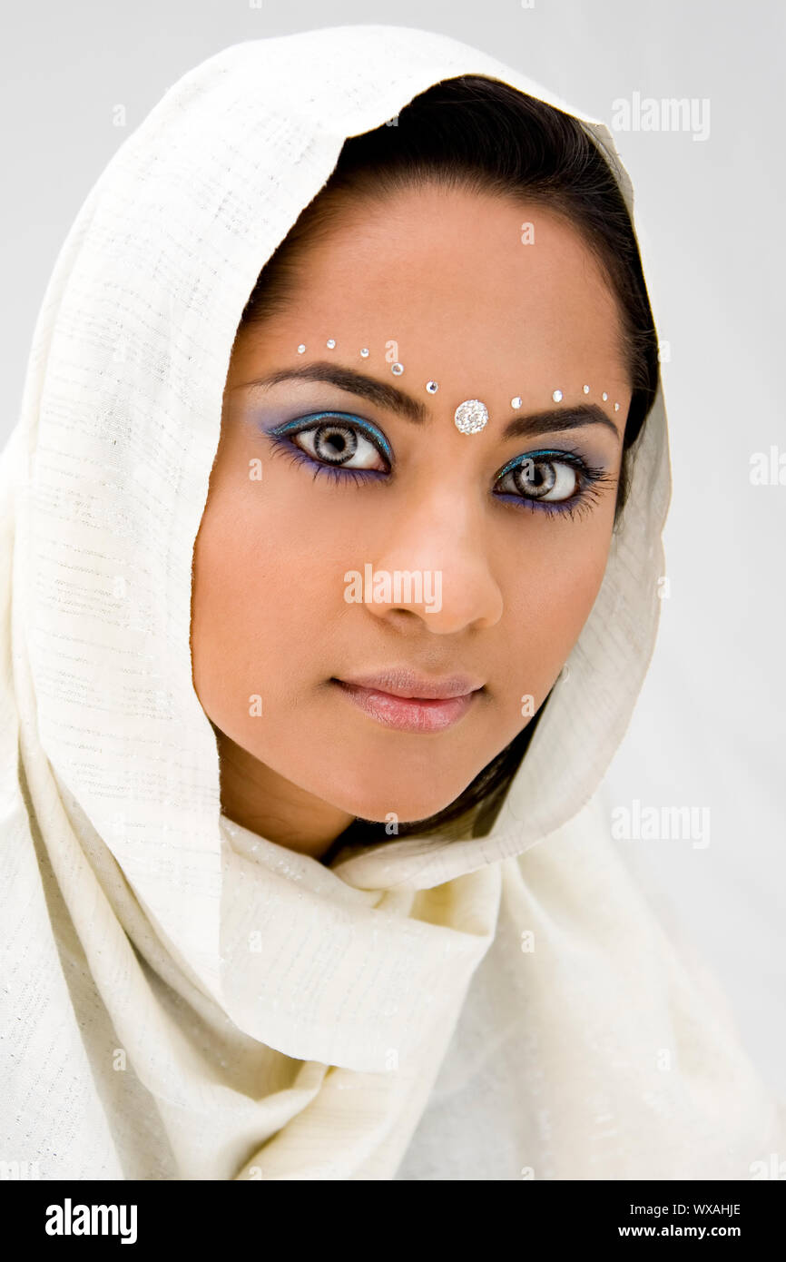 Beautiful woman with white head scarf, isolated Stock Photo - Alamy