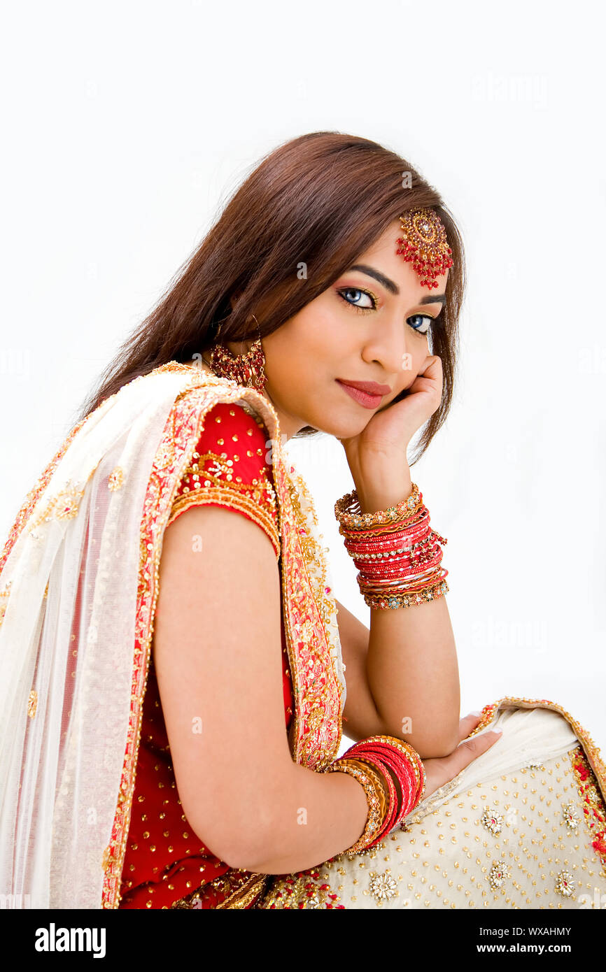 Beautiful Bengali bride in colorful dress day dreaming, isolated Stock ...