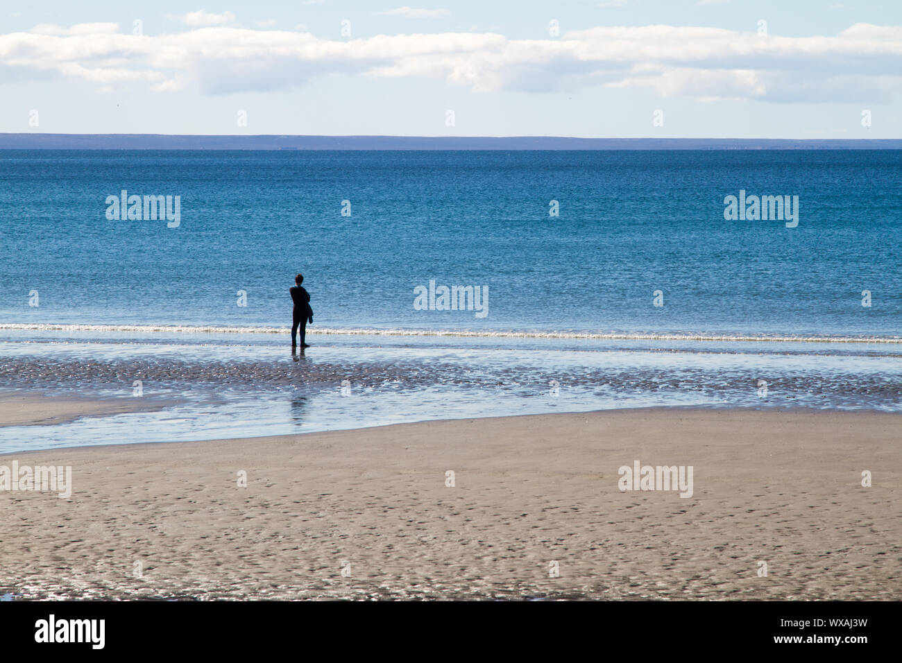 Unknown man staring at sea Stock Photo - Alamy