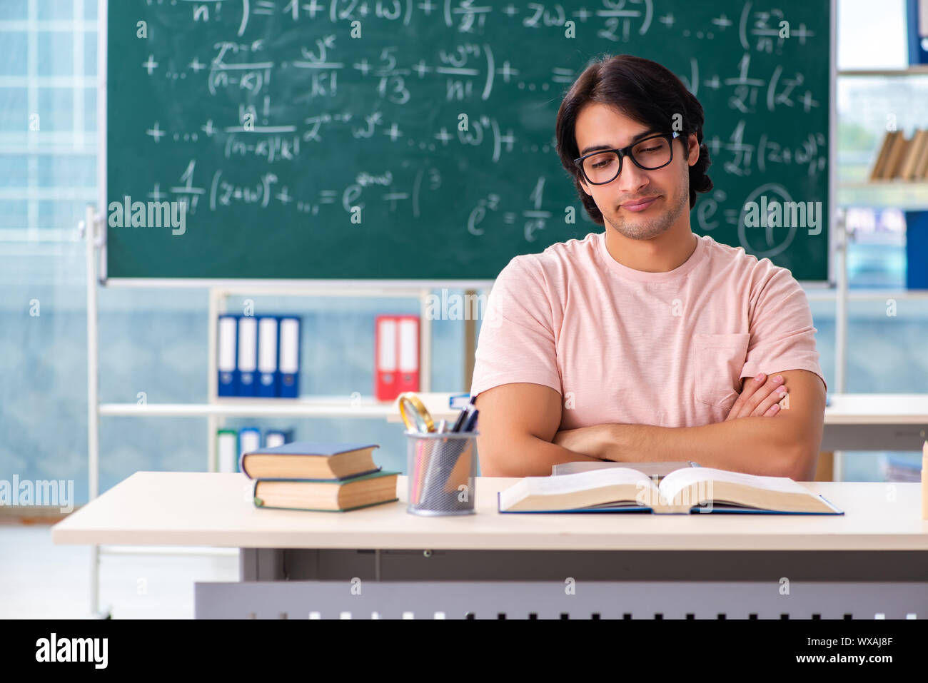 Young male student in the classroom Stock Photo - Alamy