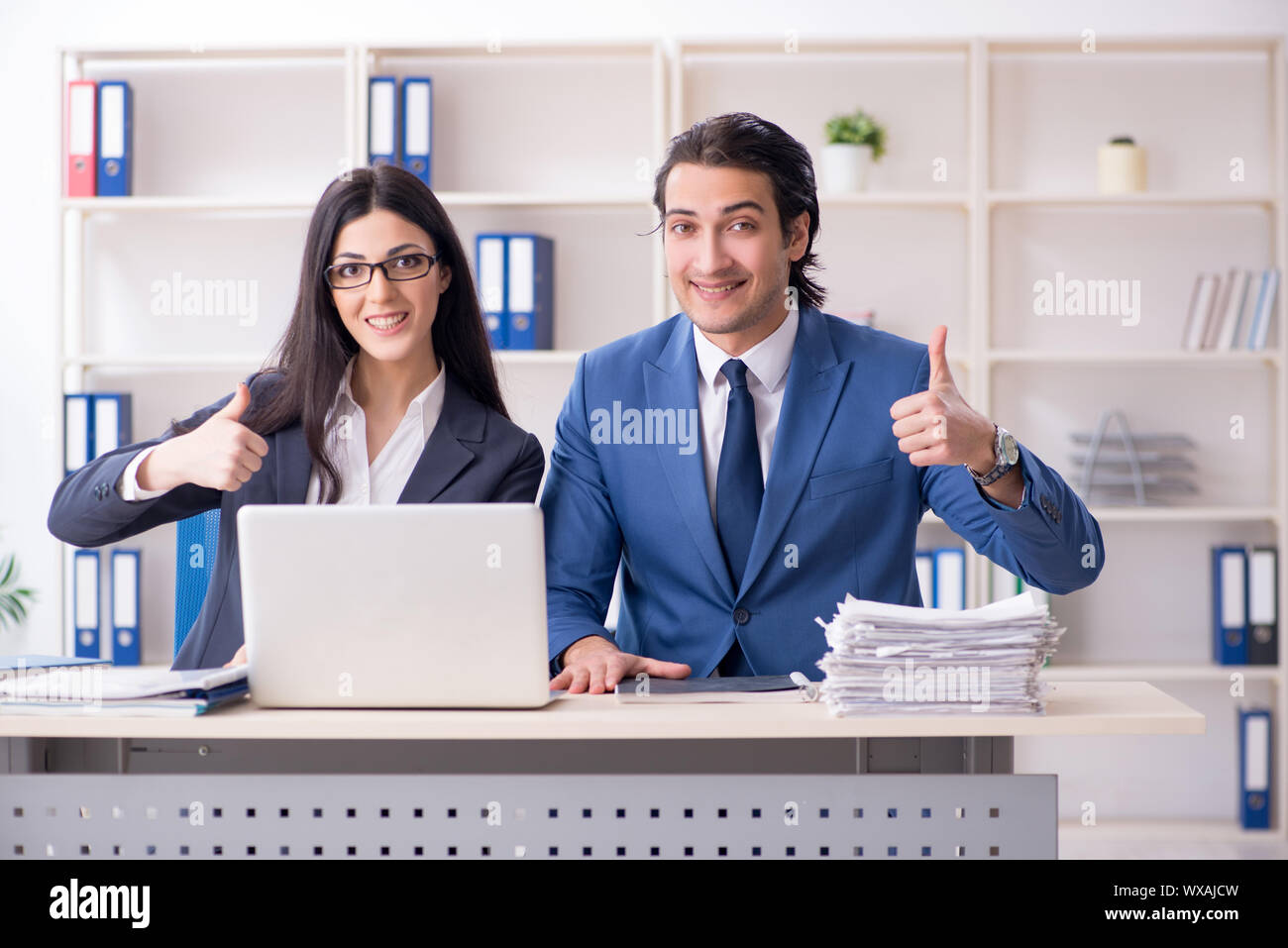 Two employees working in the office Stock Photo - Alamy