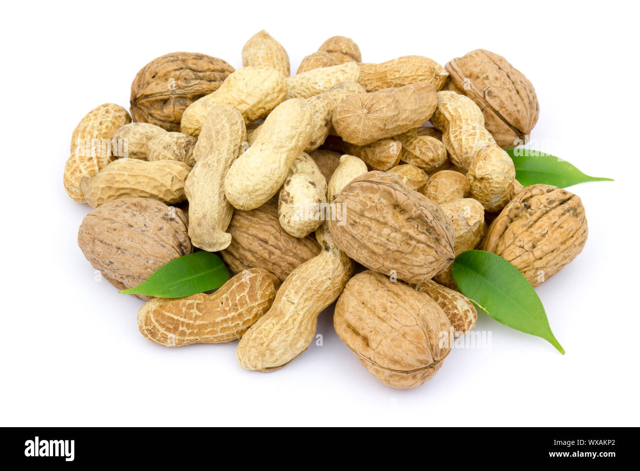walnuts and peanuts on white Stock Photo - Alamy