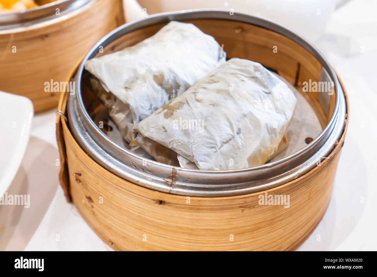 Delicious Lo Mai Gai dim sum, fresh steamed glutinous rice with chicken ...