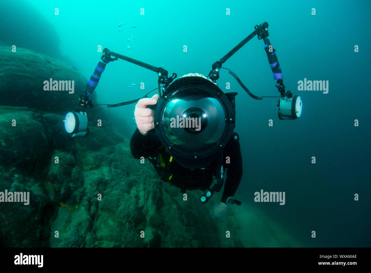 Underwater photographer in cold water Stock Photo - Alamy