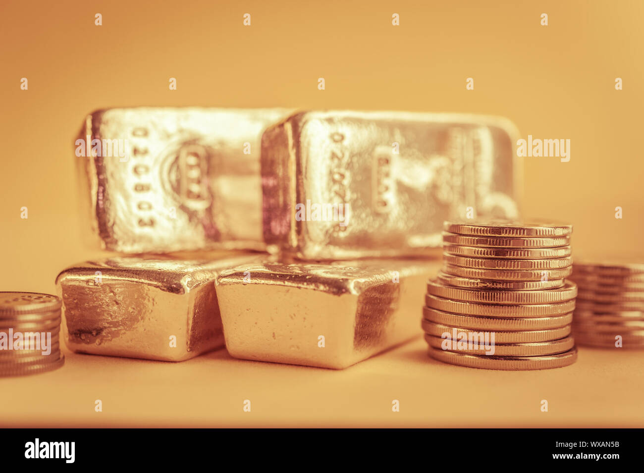 Gold bars and stack of gold coins. Background for finance banking ...