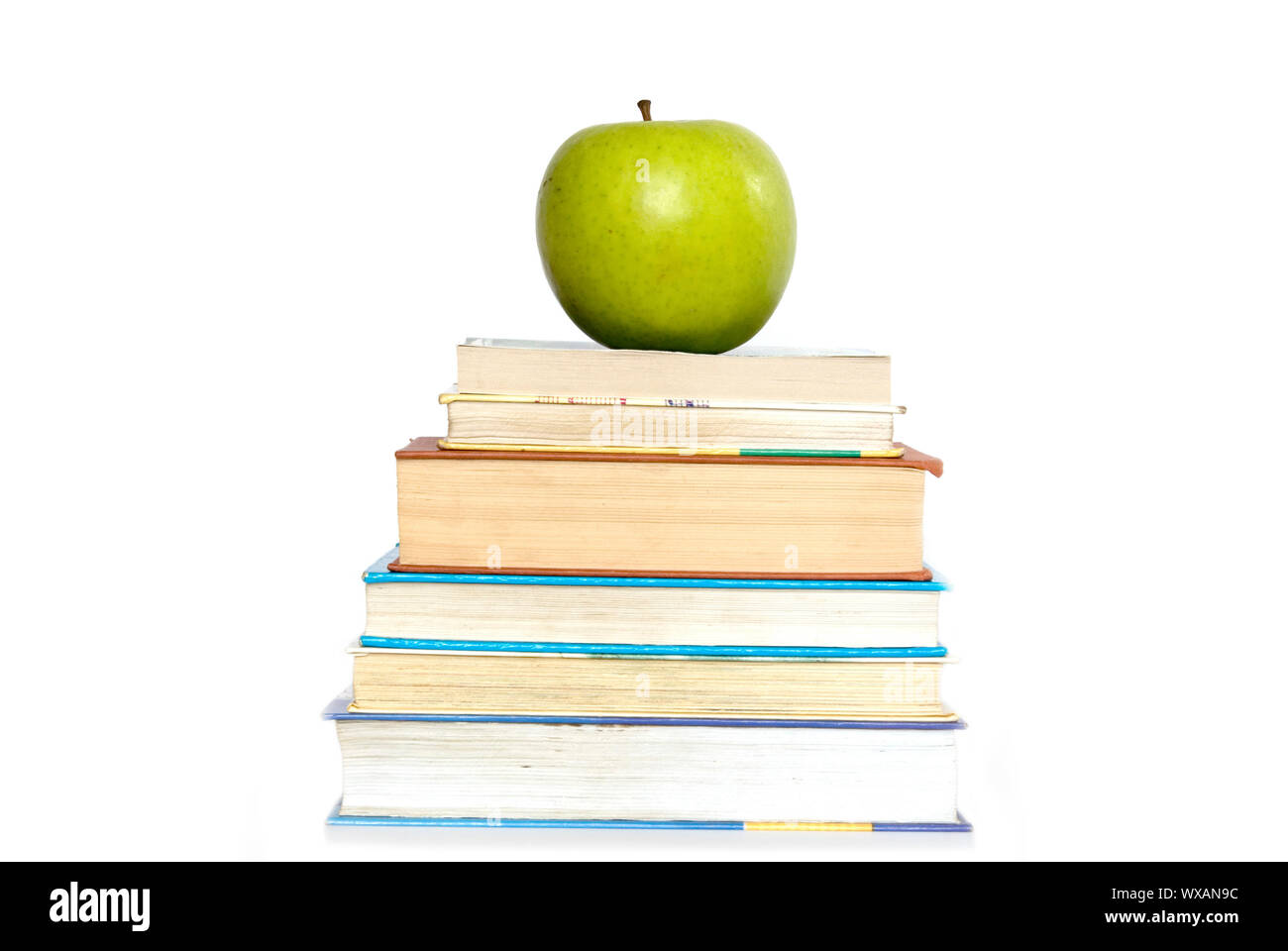 apple and stack of books for school Stock Photo - Alamy