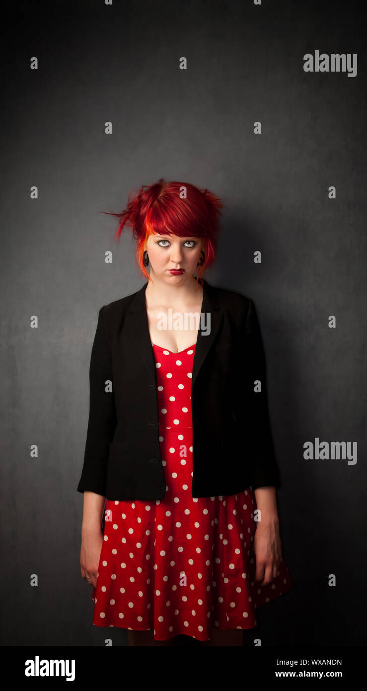 Pretty punky girl with brightly dyed red hair Stock Photo - Alamy