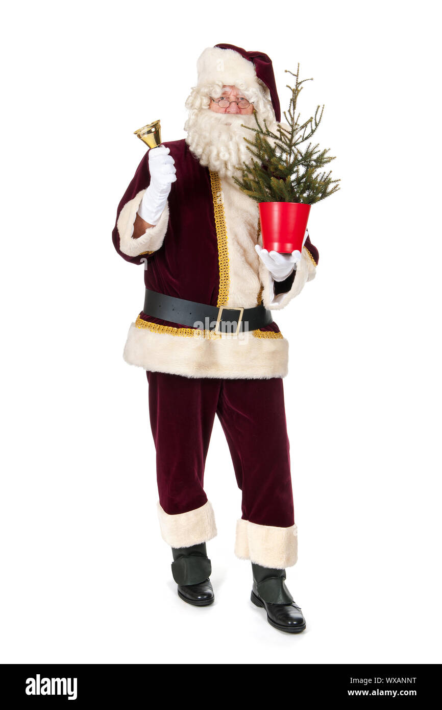 Santa Claus with Christmas tree and copper bell isolated over white ...