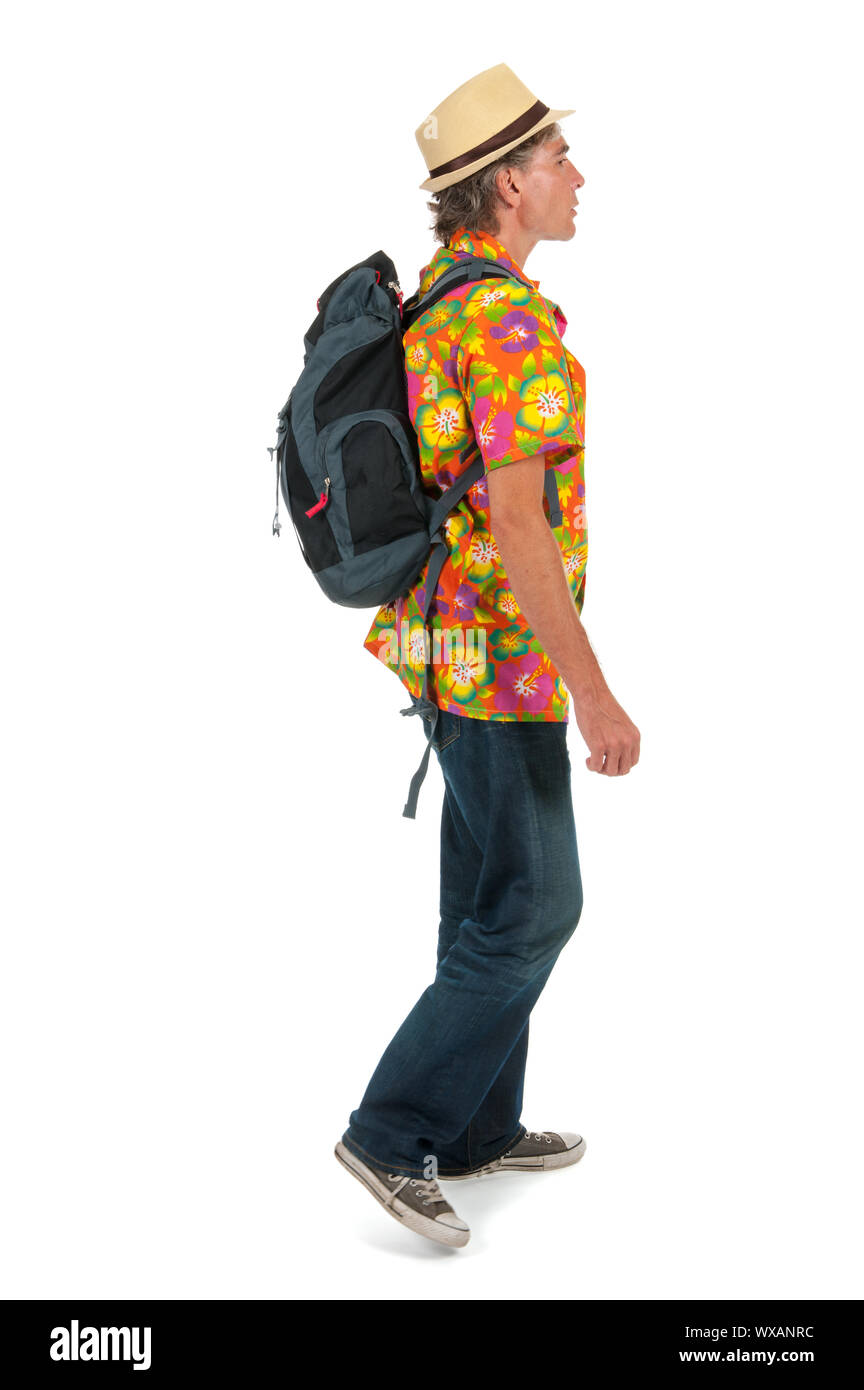 Typical tourist with backpack walking in studio Stock Photo - Alamy