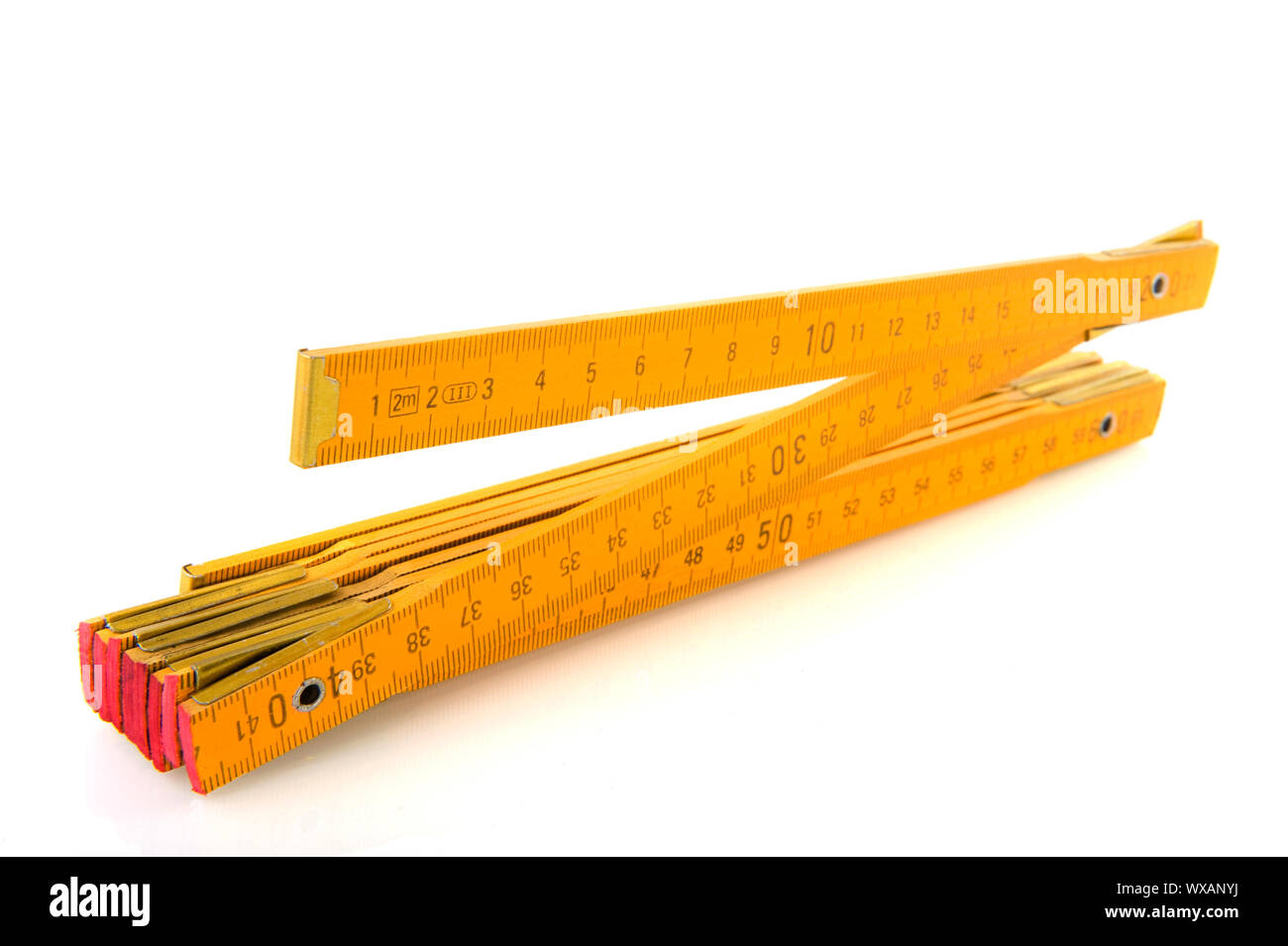 Measuring yellow work tool for the carpenter Stock Photo - Alamy