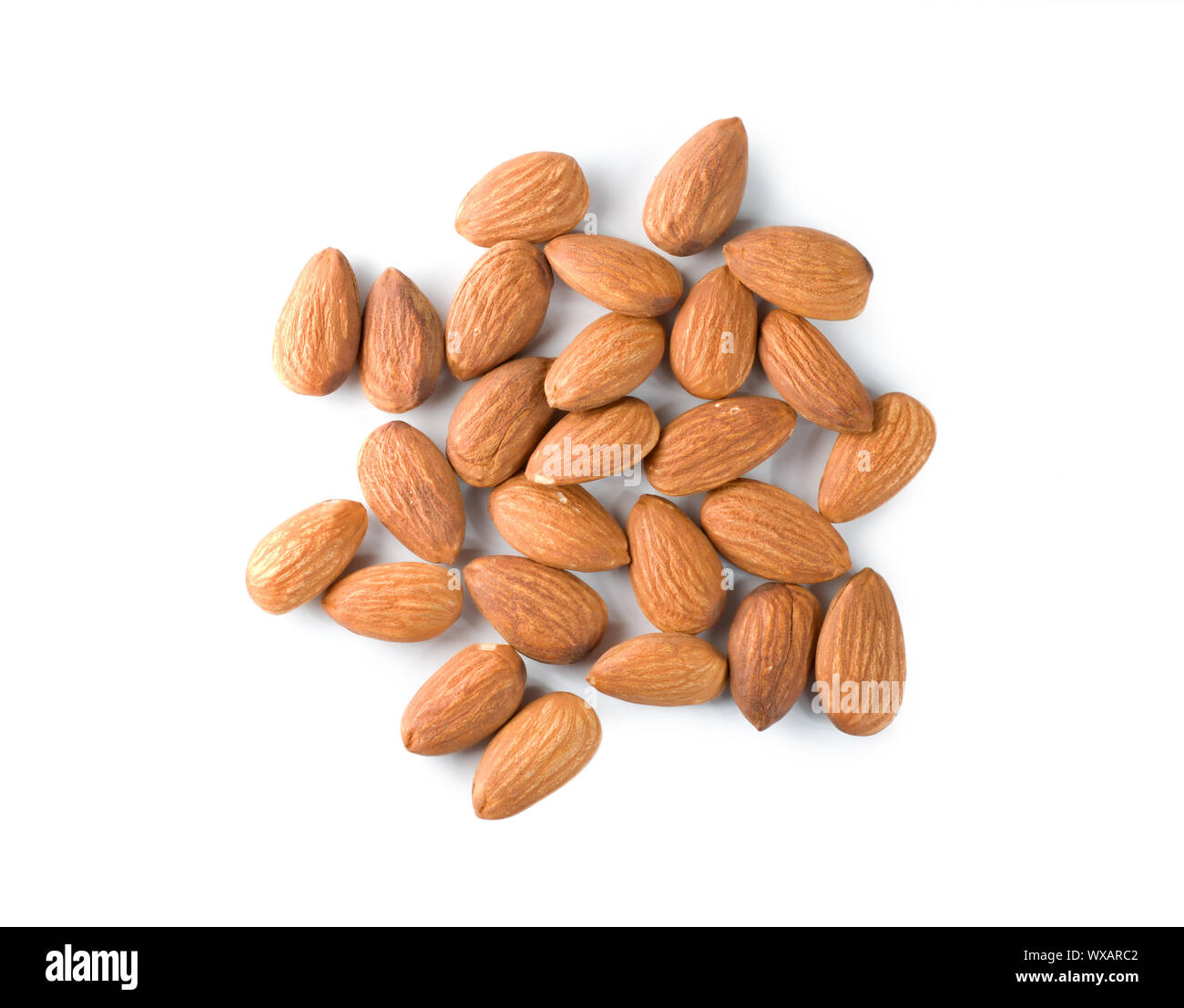Handful almond isolated on a white background Stock Photo - Alamy