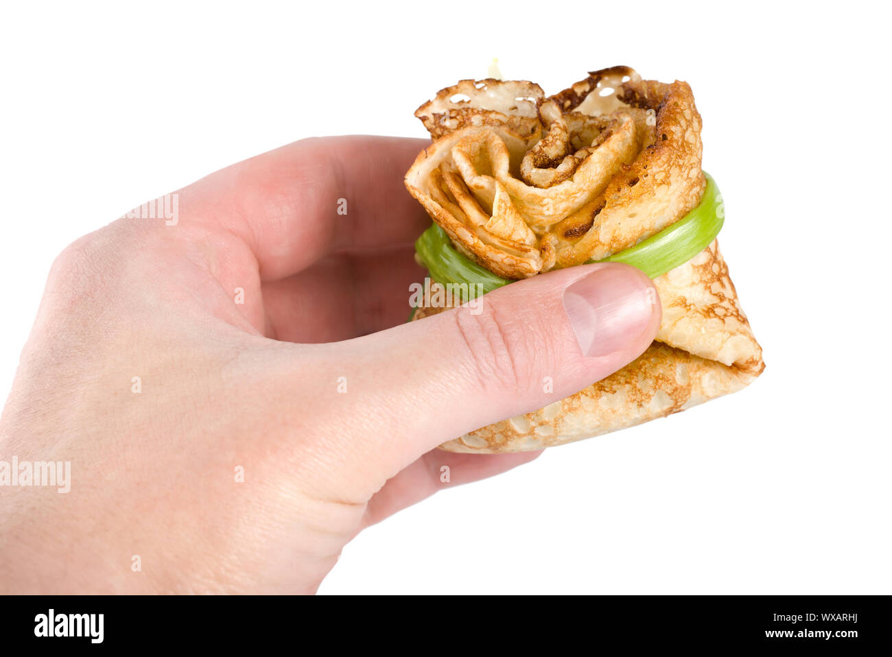 Pancake in hand isolated on white background Stock Photo - Alamy