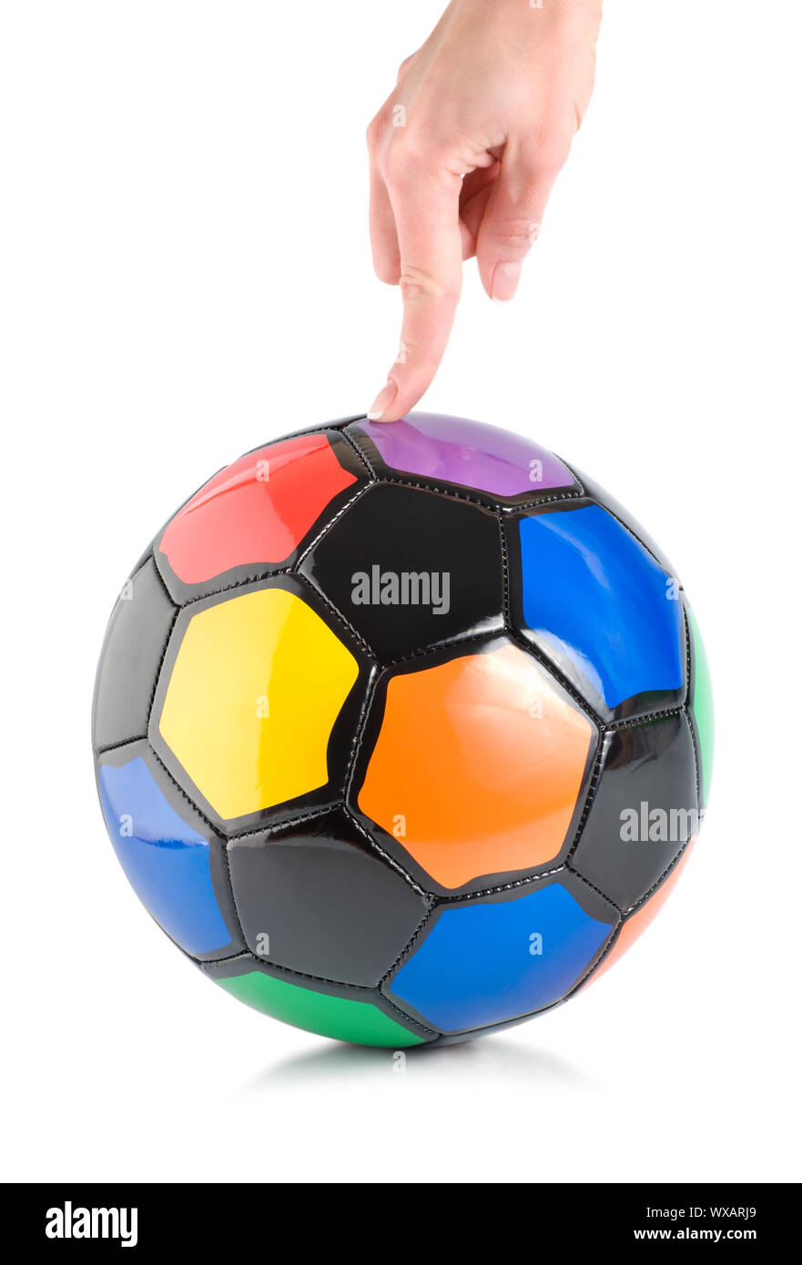 Soccer ball in hand isolated on white background Stock Photo - Alamy