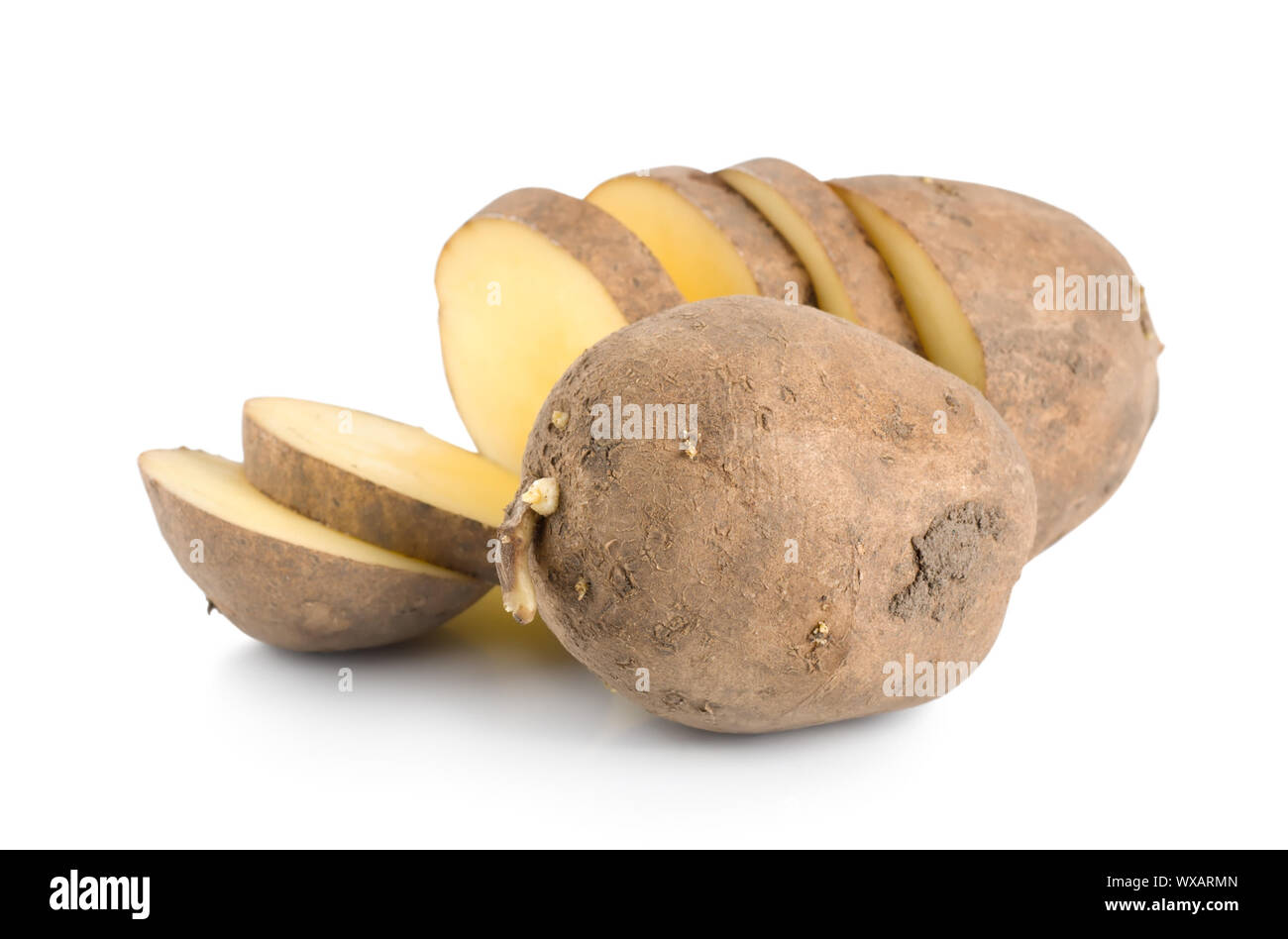 Cut potatoes isolated on a white background Stock Photo - Alamy