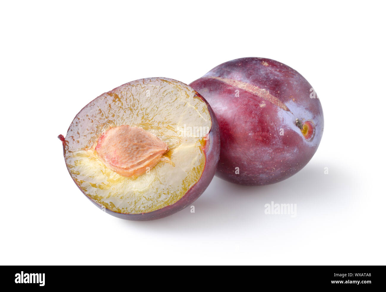 Two plums isolated on a white background Stock Photo - Alamy
