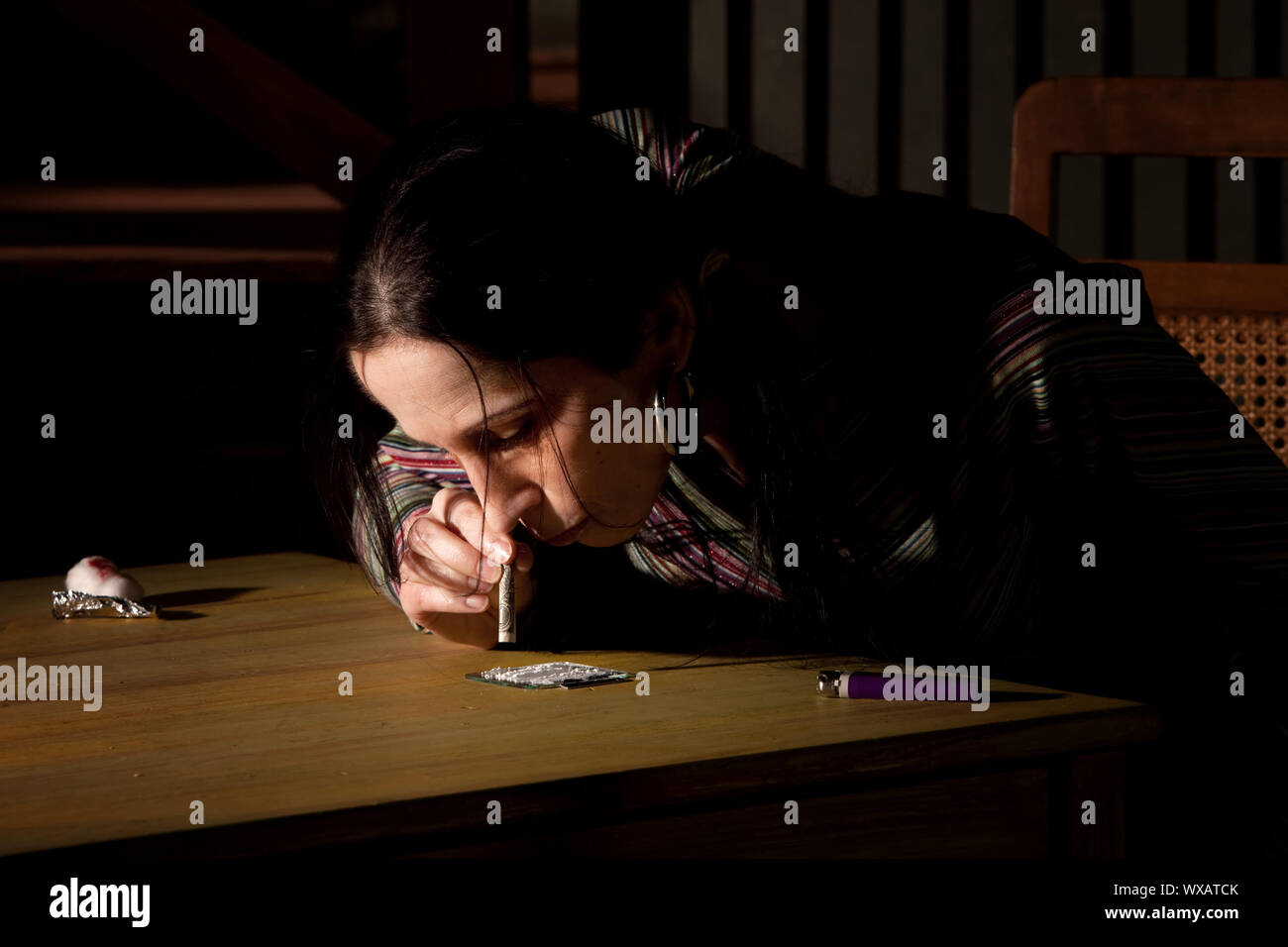 Woman snorting cocaine hi-res stock photography and images - Alamy