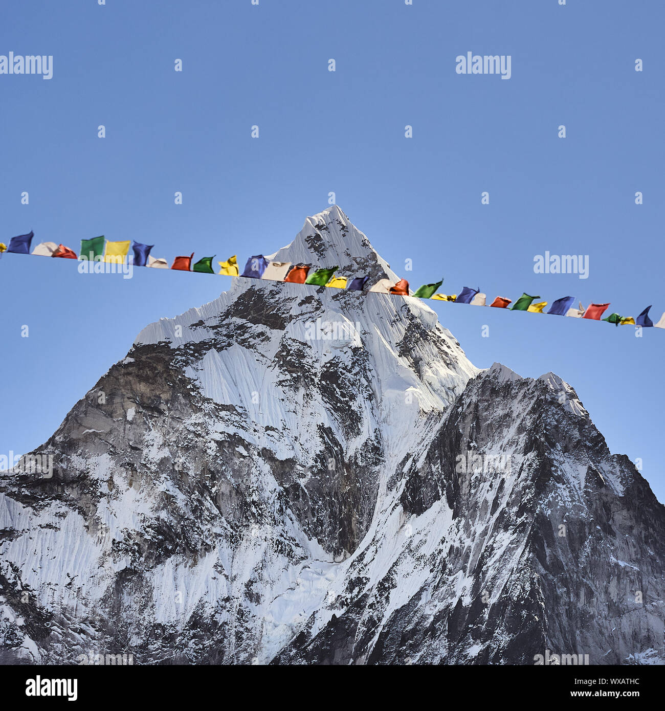 Peak of Ama Dablam with prayer flags in Nepal Stock Photo - Alamy