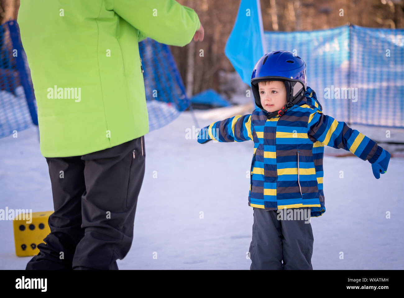 Little boy having first ski lesson Stock Photo - Alamy