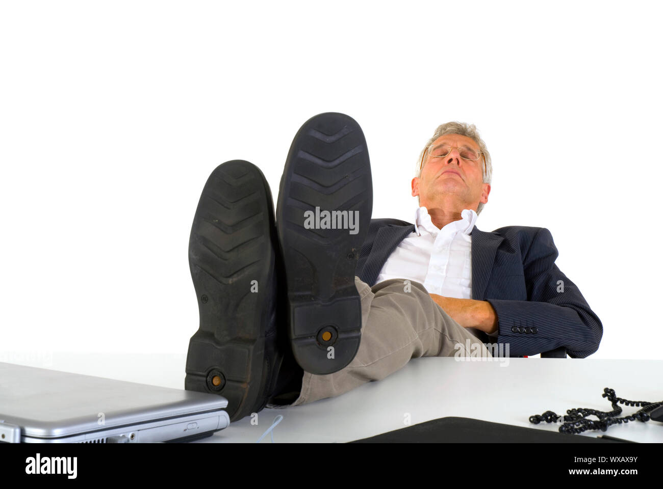 Senior CEO is sleeping at the office Stock Photo - Alamy