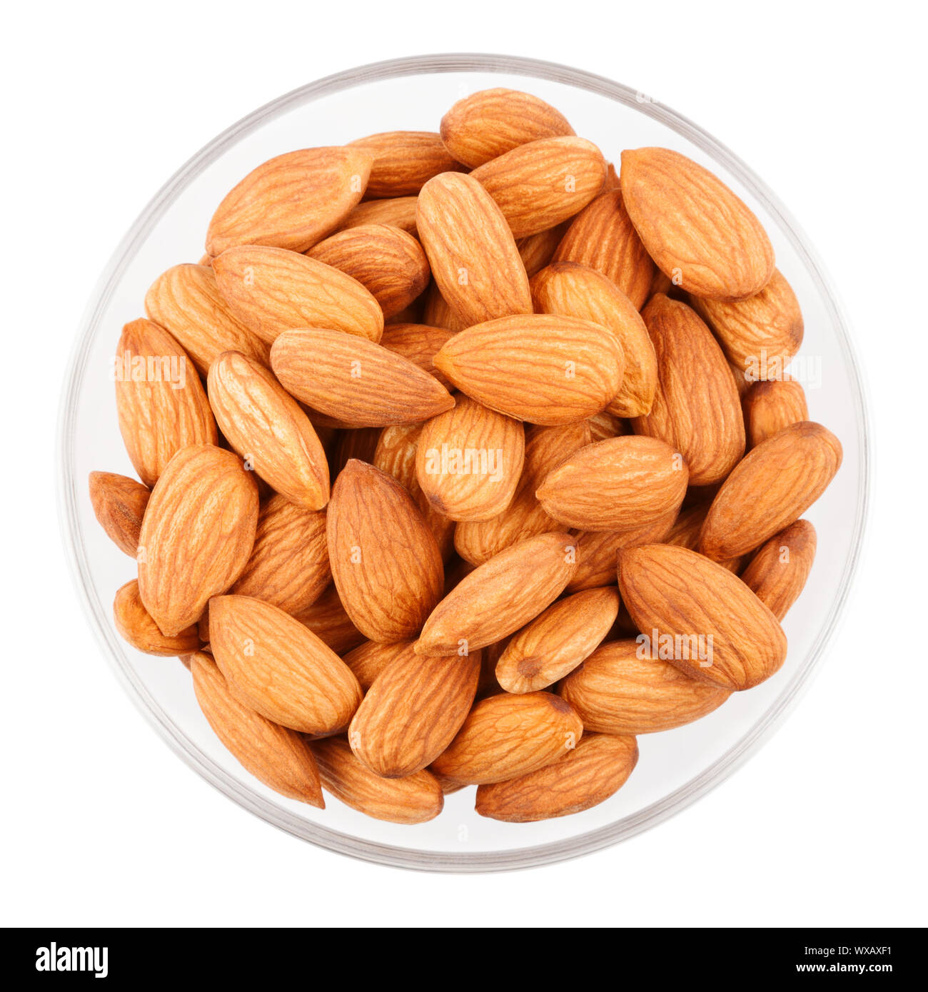 Bowl with dried almonds isolated on a white background Stock Photo - Alamy