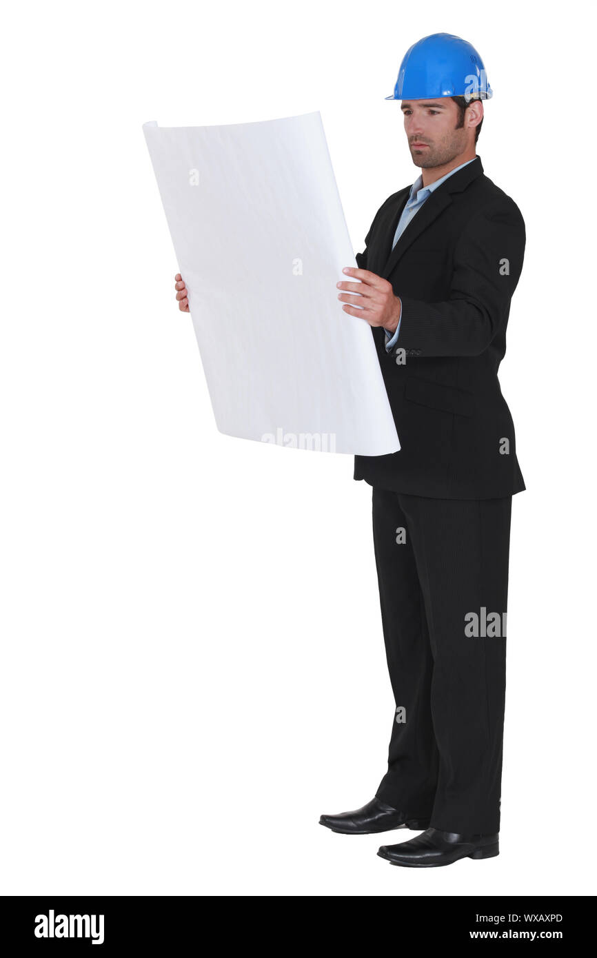 Portrait of an architect reading plans Stock Photo - Alamy