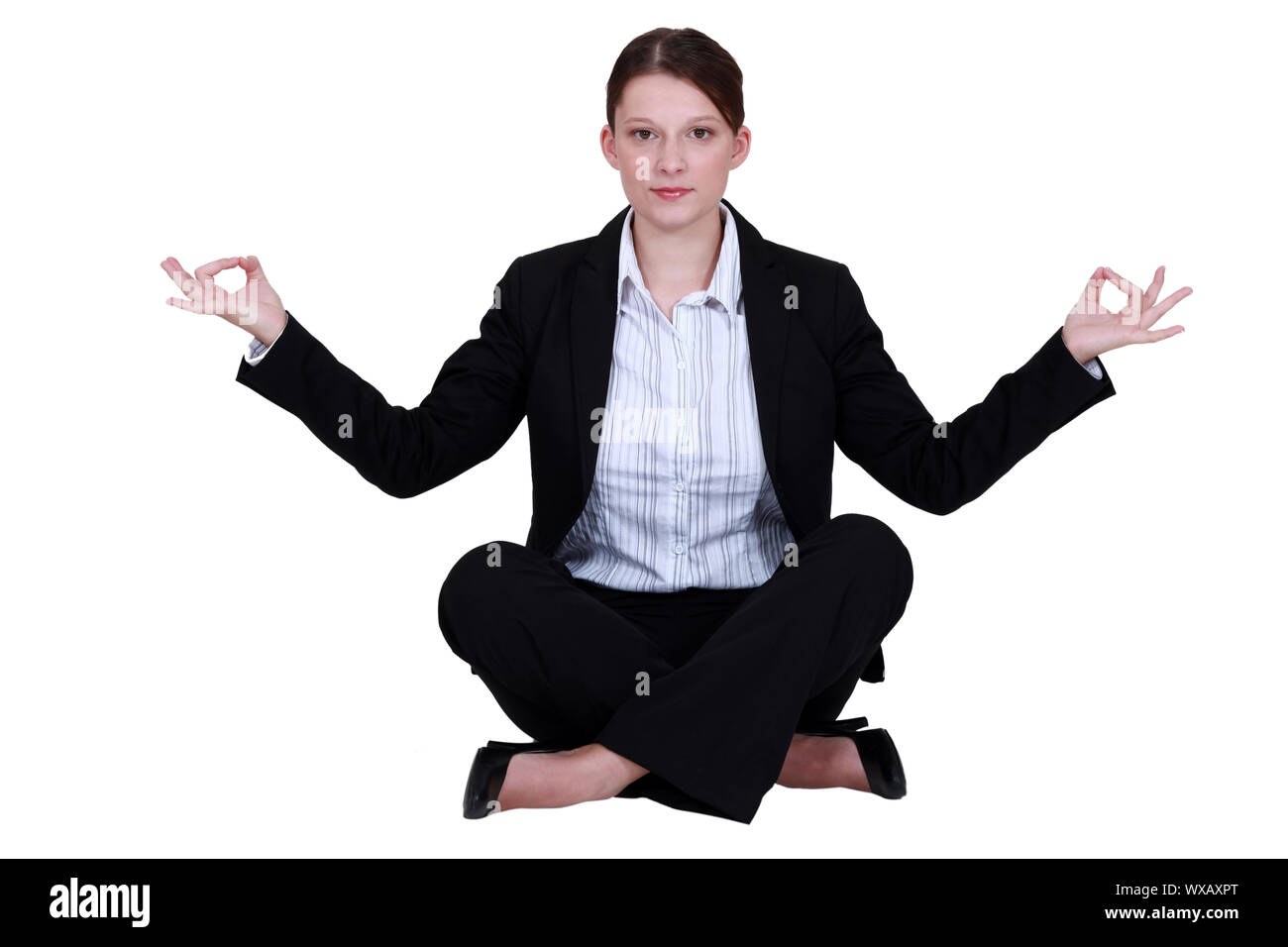 A businesswoman in a lotus position Stock Photo - Alamy