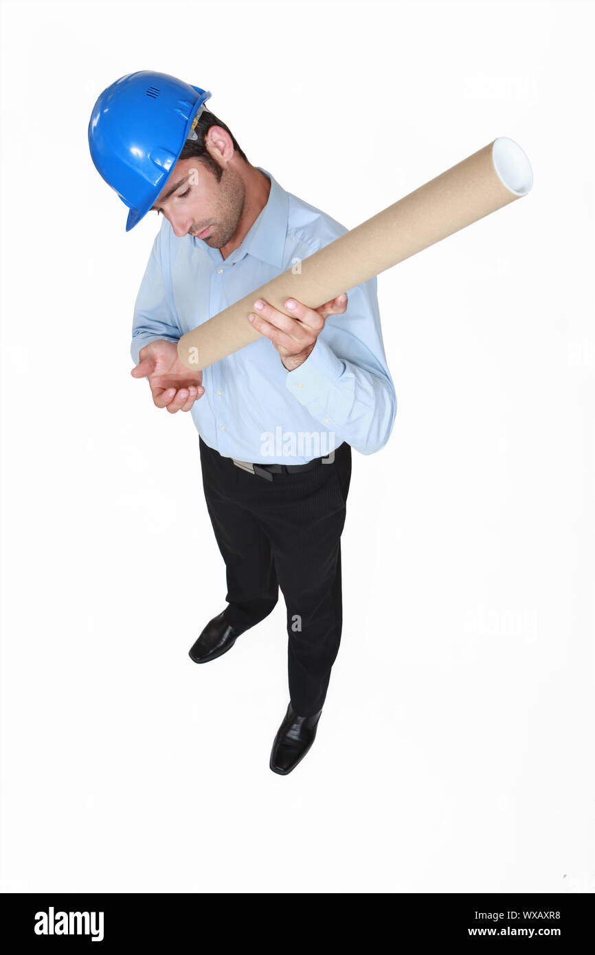 Architect with a tube of paper Stock Photo - Alamy