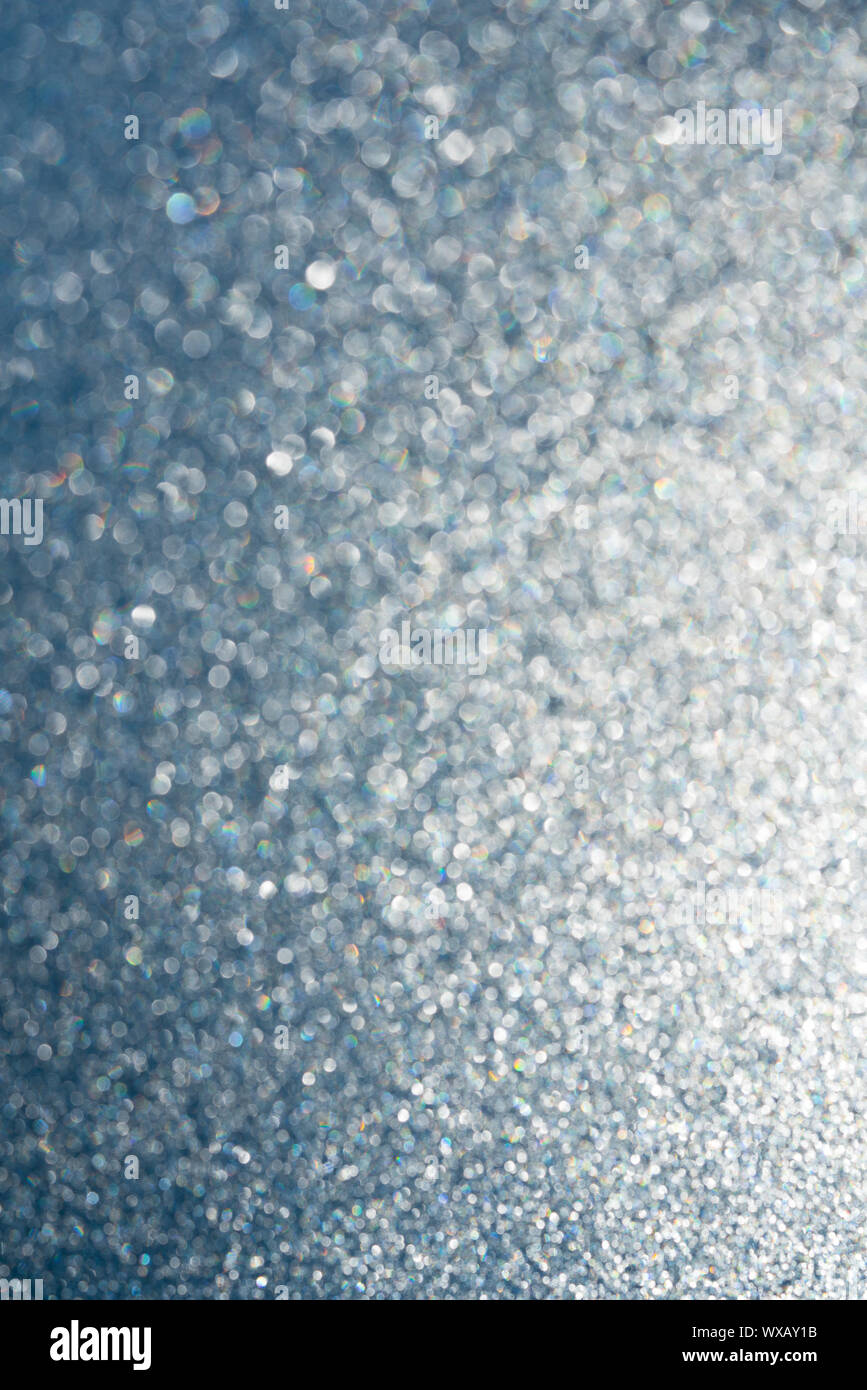 vertical gradient background of bright light and blue through rippled ...