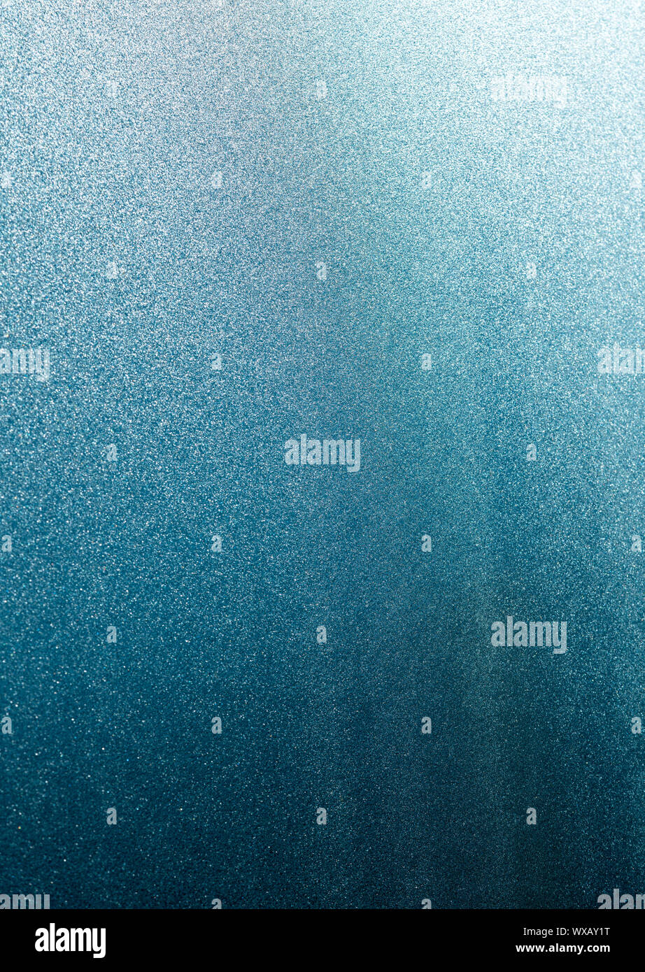 vertical gradient background of bright light and blue through rippled ...