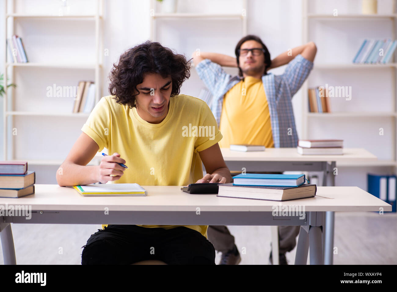 Two male students in the classroom Stock Photo - Alamy
