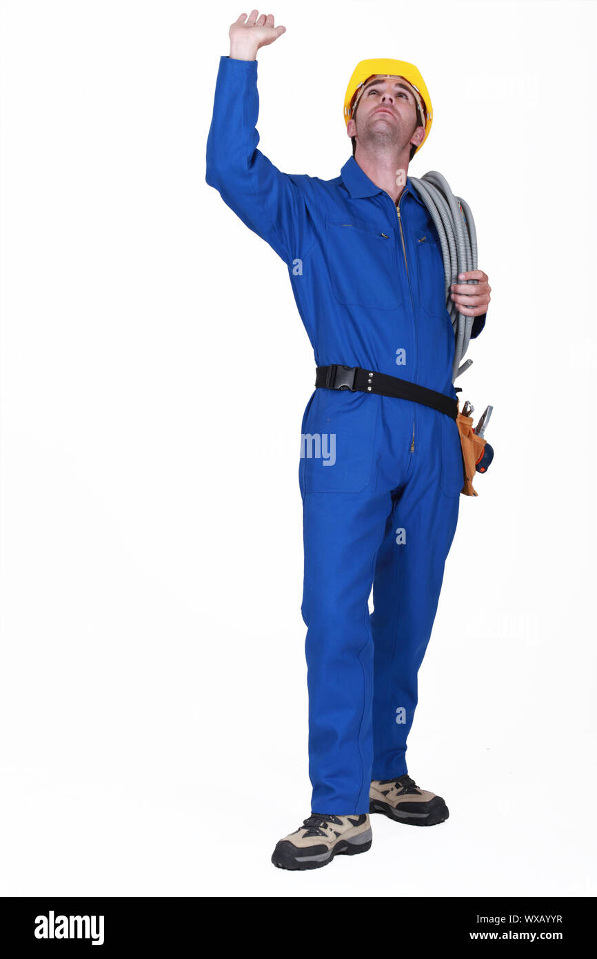 Electrician touching ceiling Stock Photo - Alamy