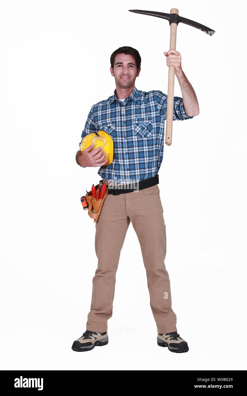 Workman with a pickaxe Stock Photo - Alamy