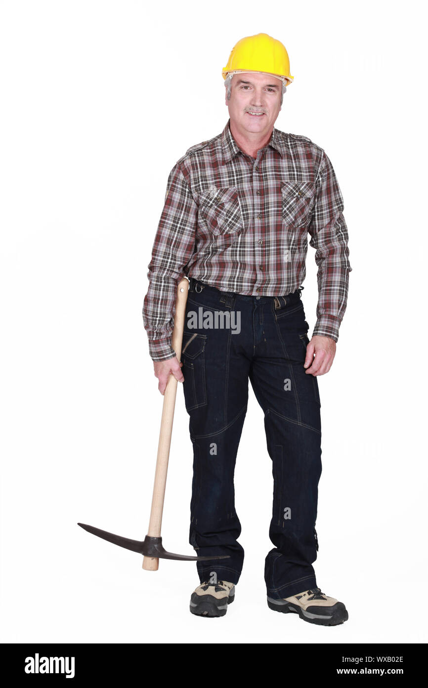 Middle-aged man with pick-axe Stock Photo - Alamy