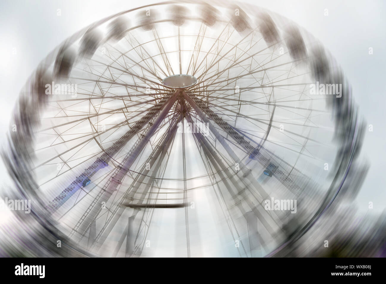 The Spinning Ferris wheel. Motion blur effect. Very popular attraction ...
