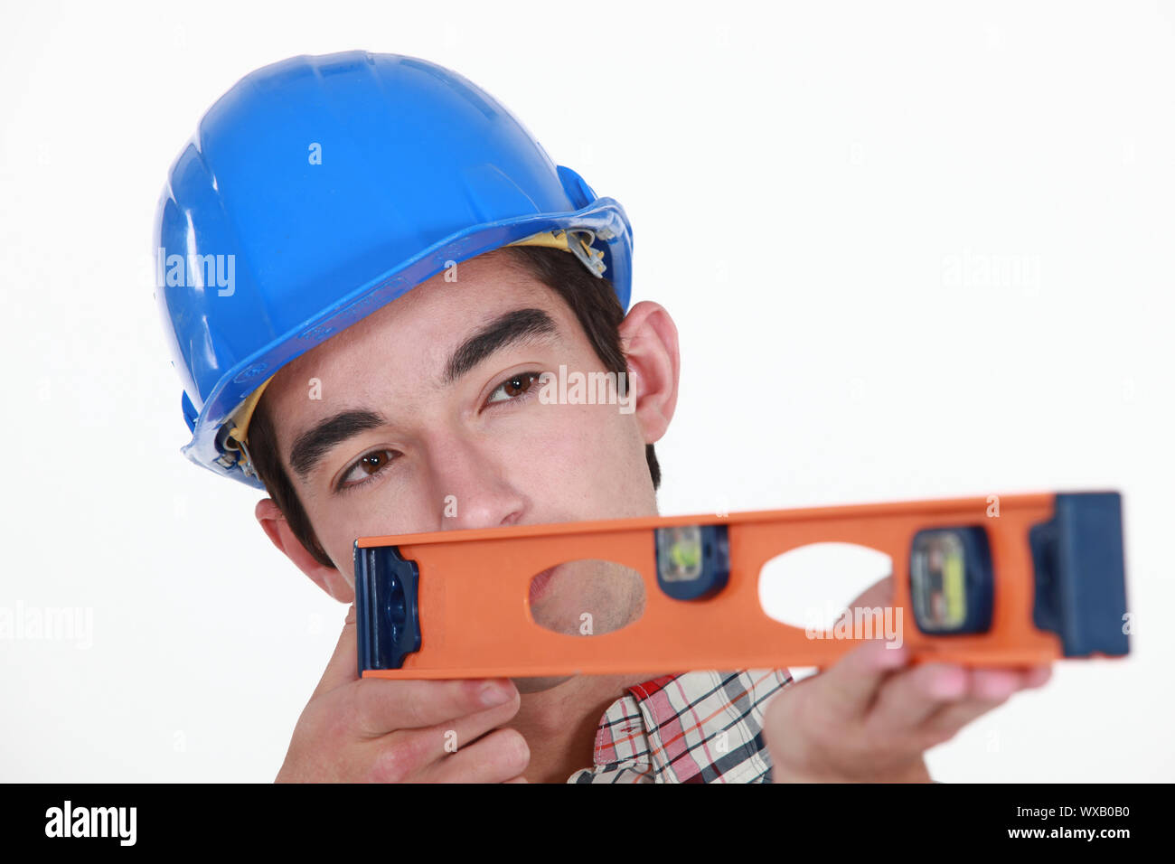 young carpenter using ruler Stock Photo - Alamy