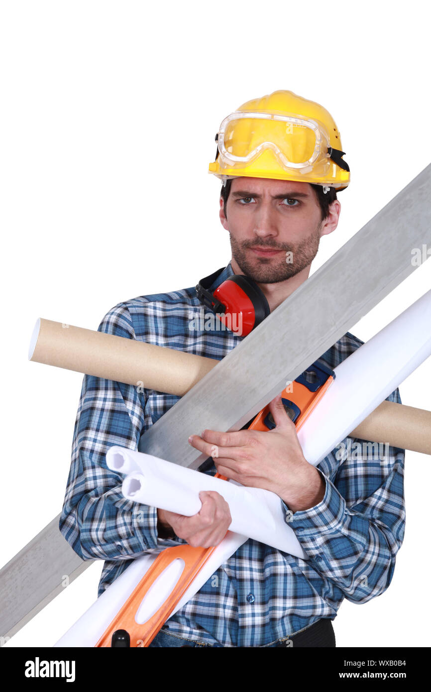 Handyman struggling to carry his equipment Stock Photo - Alamy