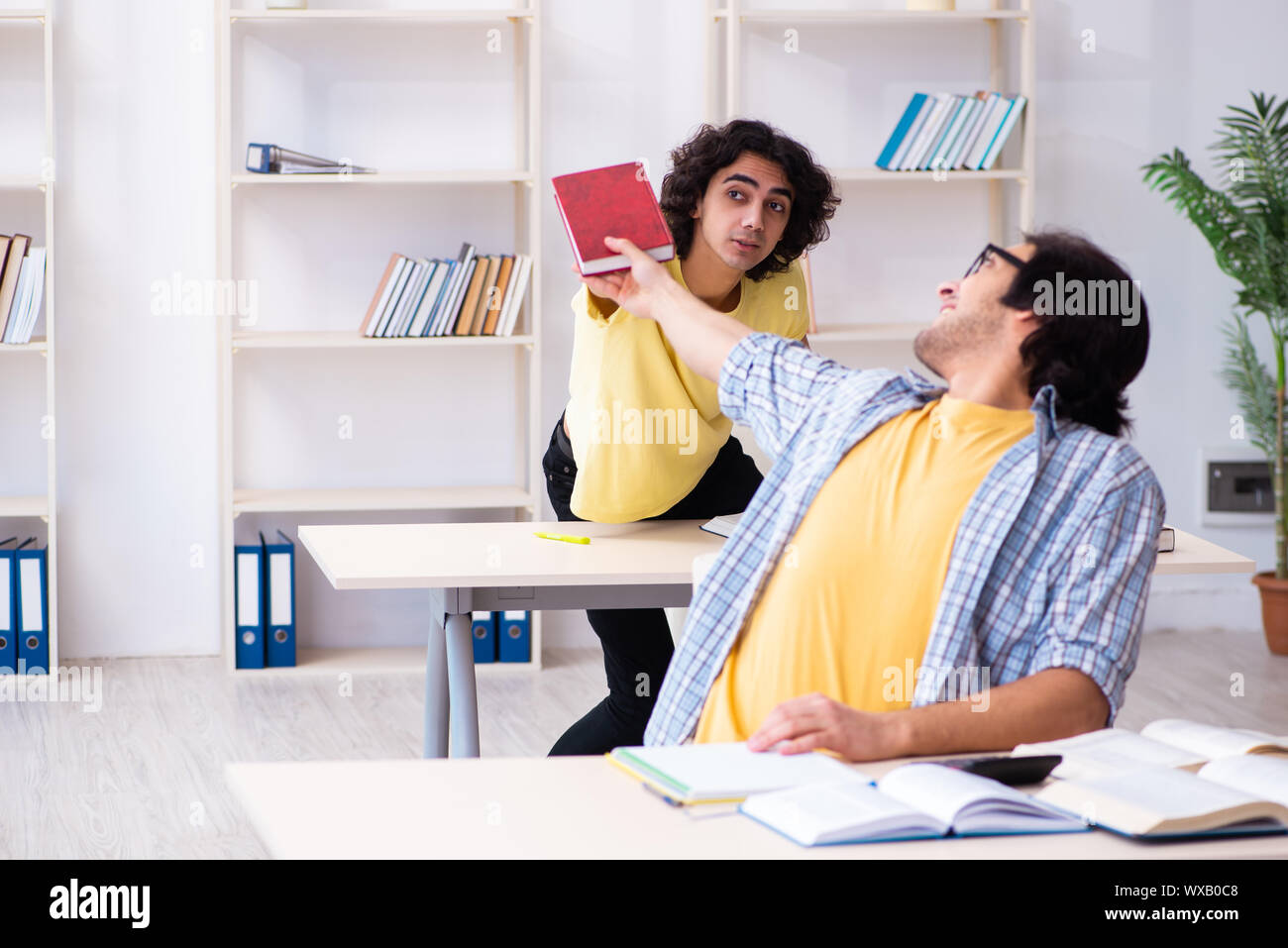 Two male students in the classroom Stock Photo - Alamy