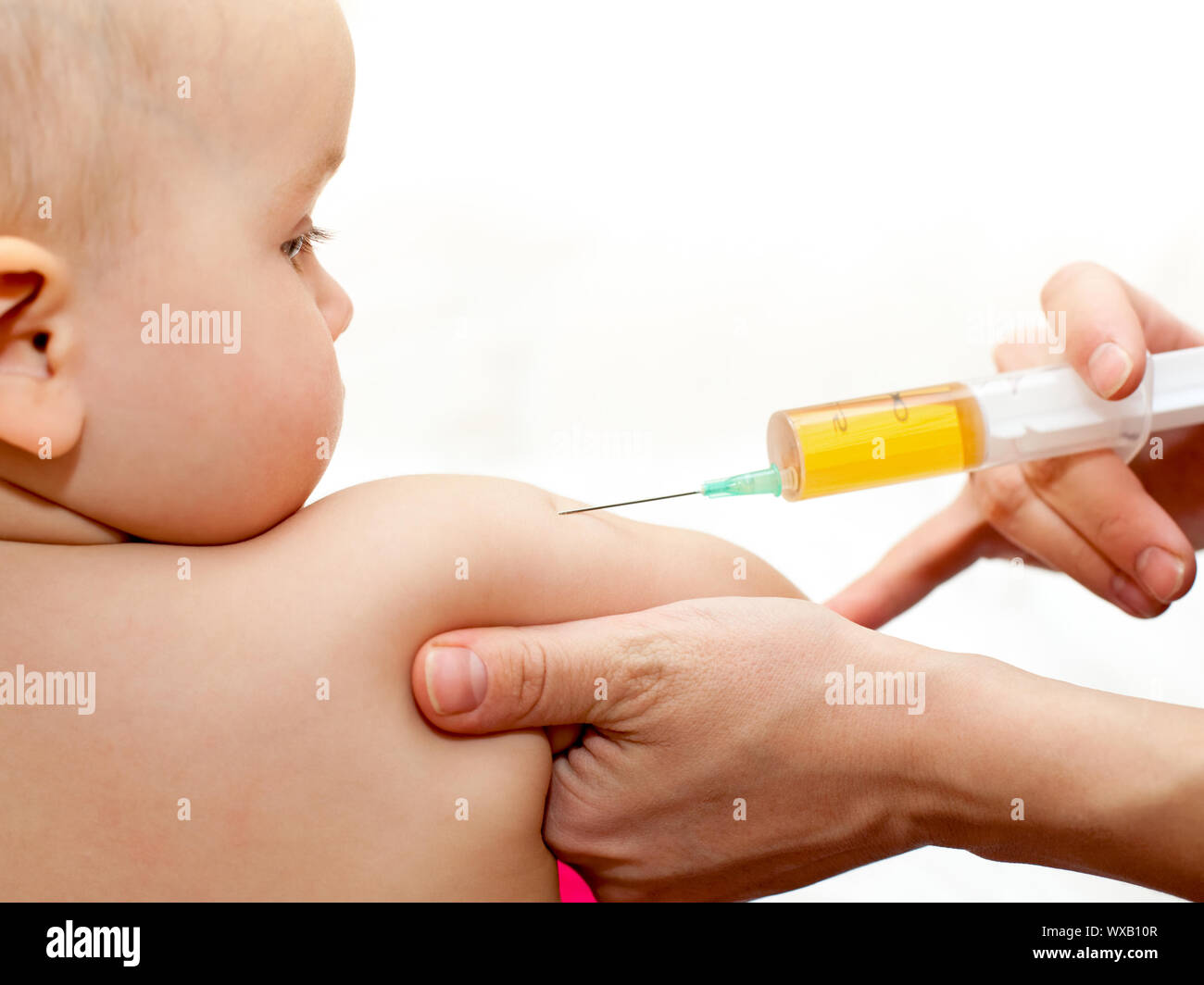 Nurse giving intramuscular injection in hi-res stock photography and ...
