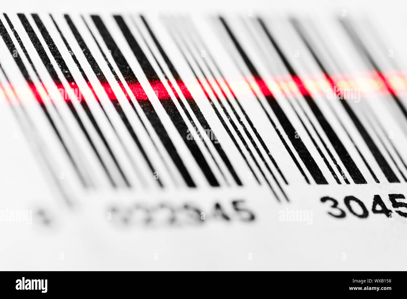 Barcode scanned by laser reader closeup Stock Photo - Alamy