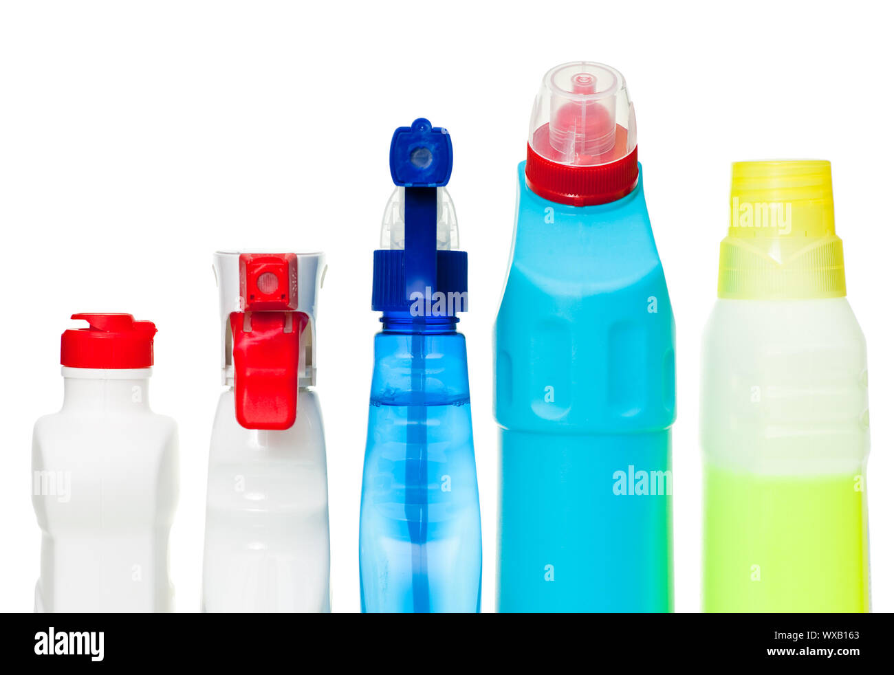 Cleaning supplies in a row on white background Stock Photo - Alamy