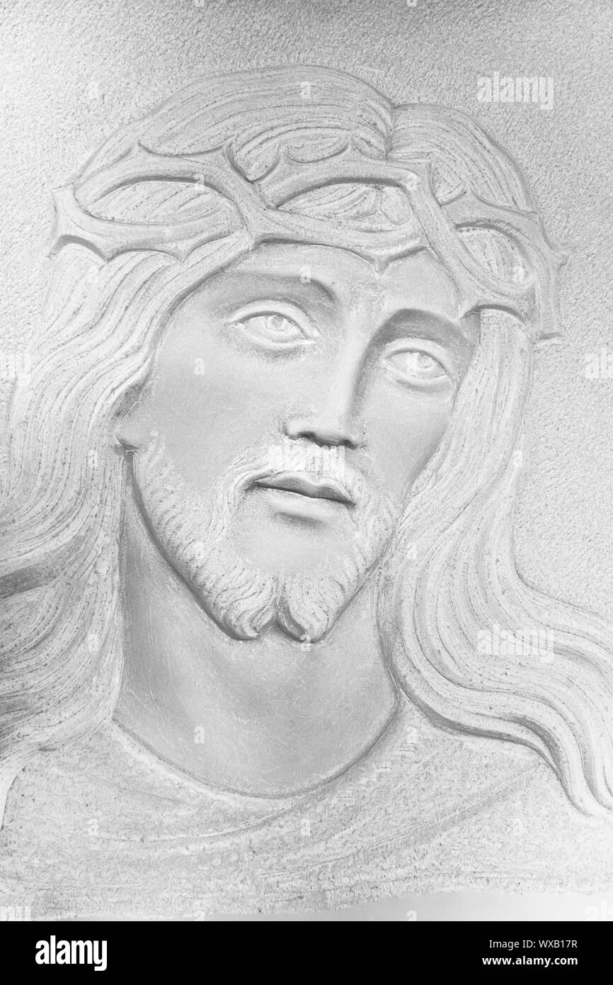 Stone white Bas-relief of the face of Christ Stock Photo - Alamy