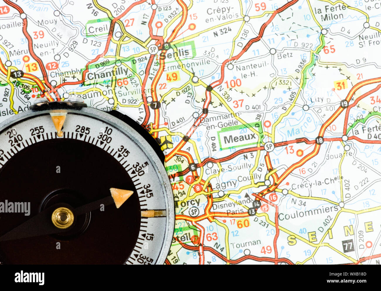 Navigation with compass and map Stock Photo - Alamy
