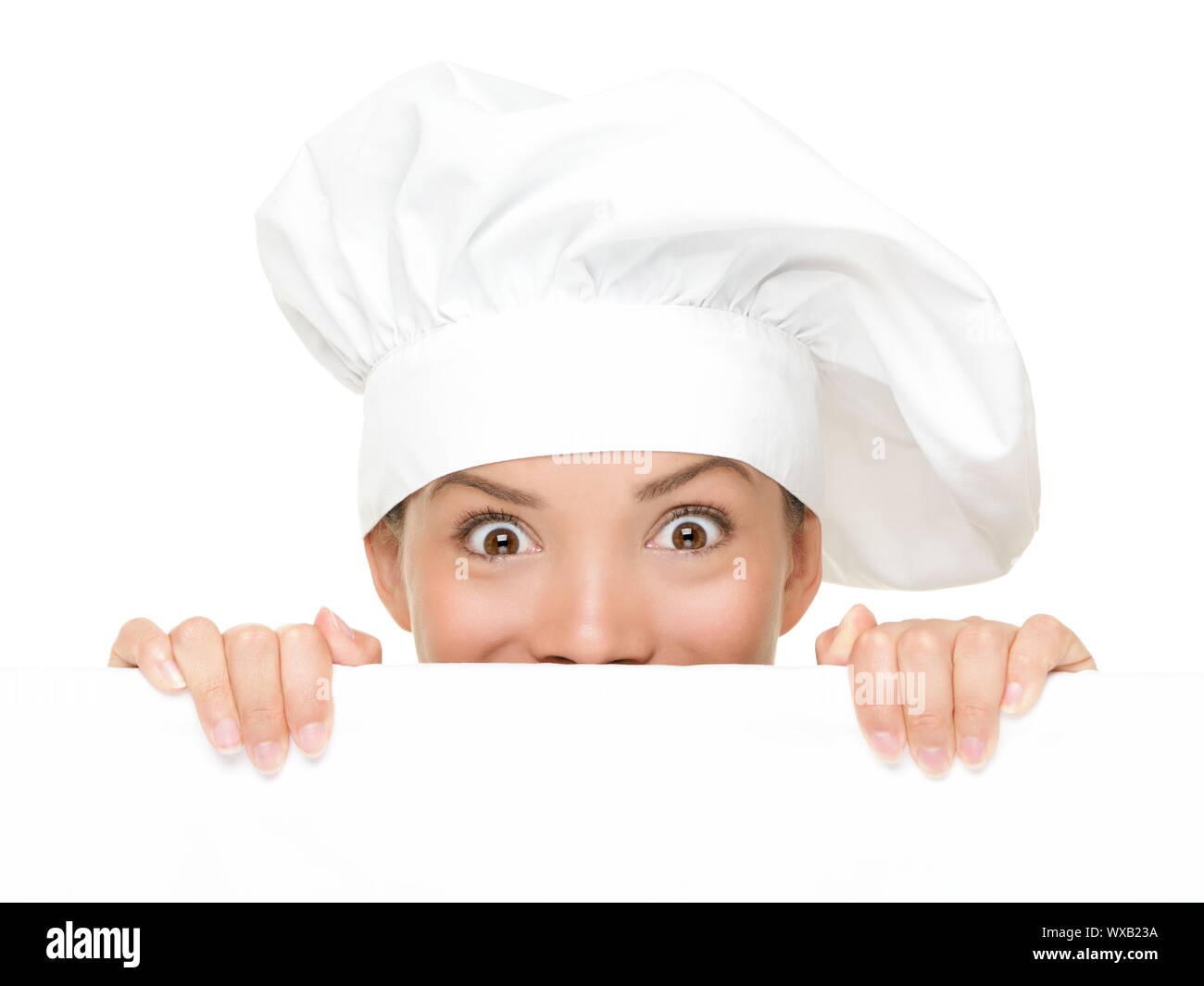 Chef Sign. Woman cook / baker looking over paper sign billboard ...