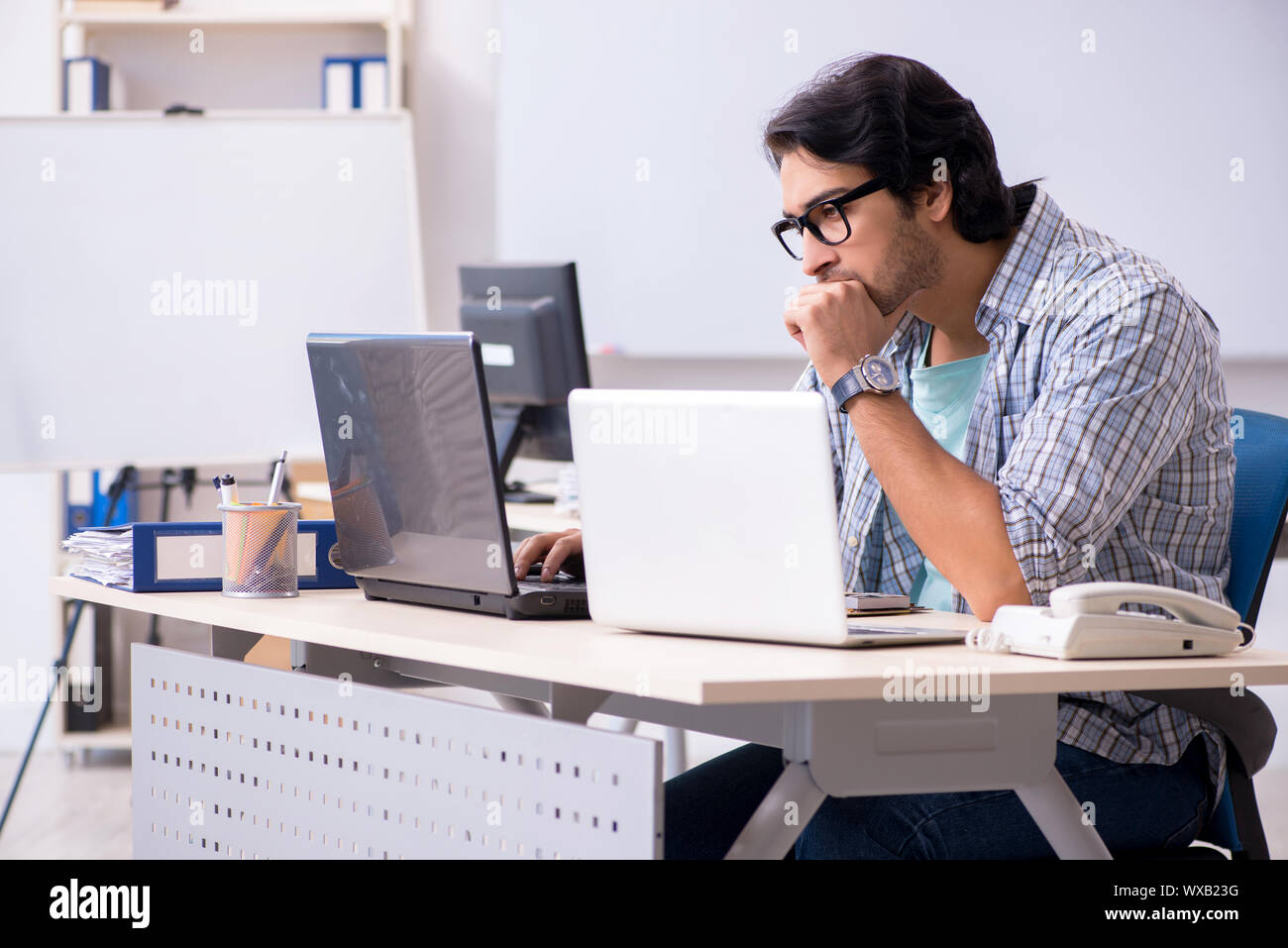 It specialist working in the office Stock Photo - Alamy