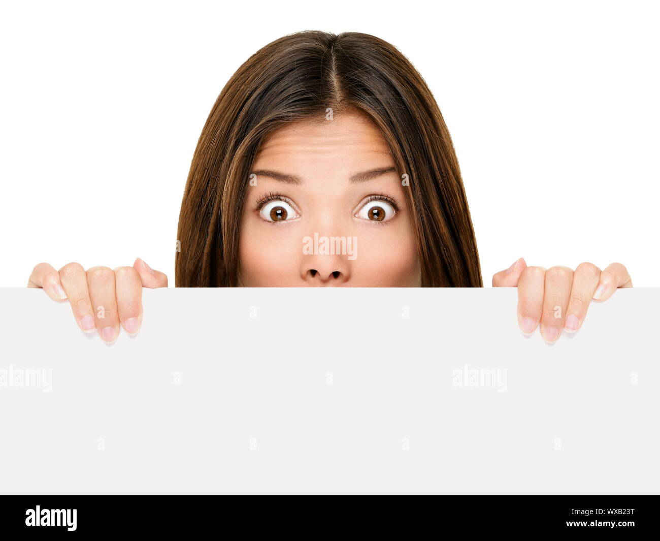 Banner sign woman peeking over edge of blank empty paper billboard with ...