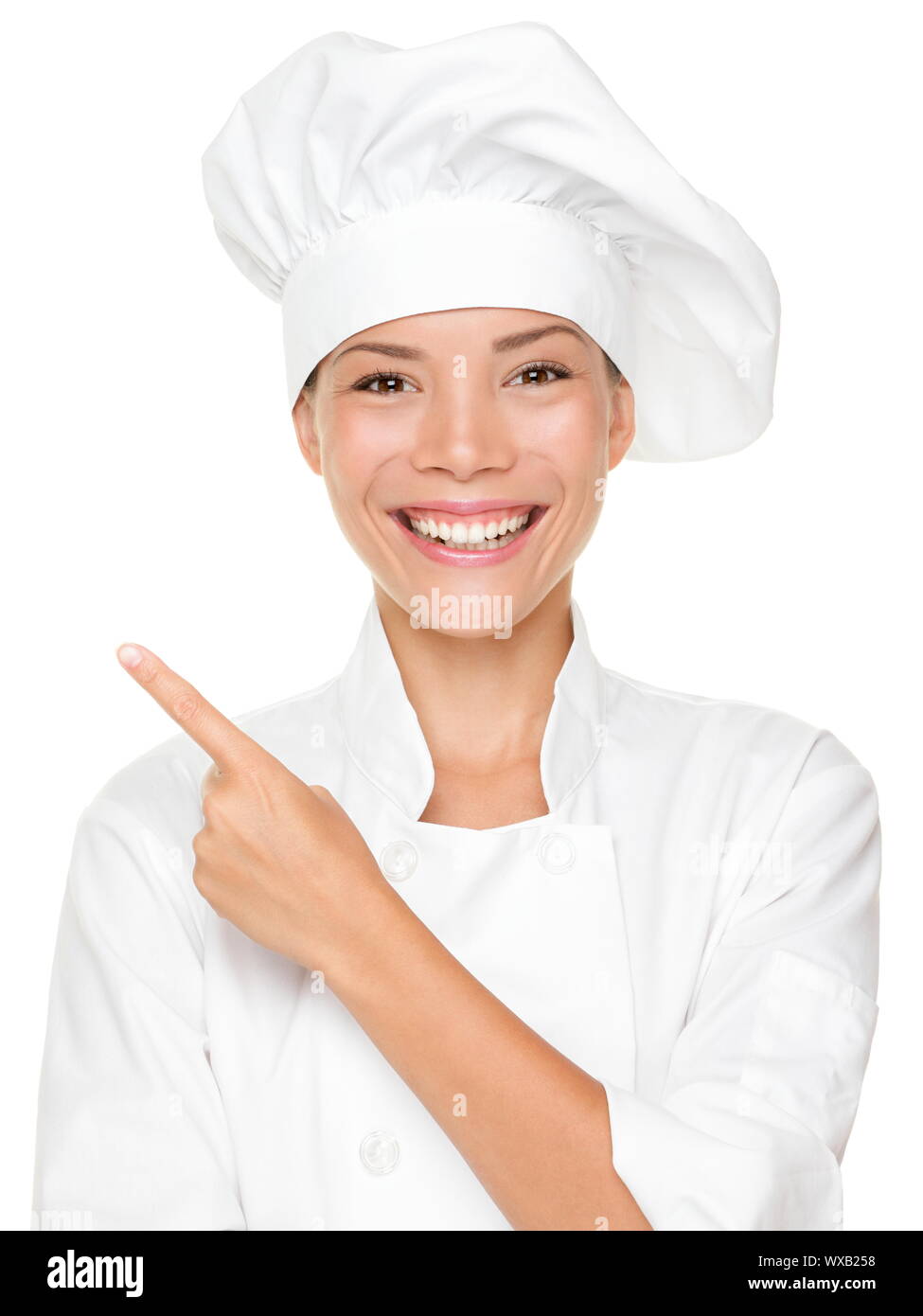 Woman chef pointing / showing empty blank copy space isolated on white ...